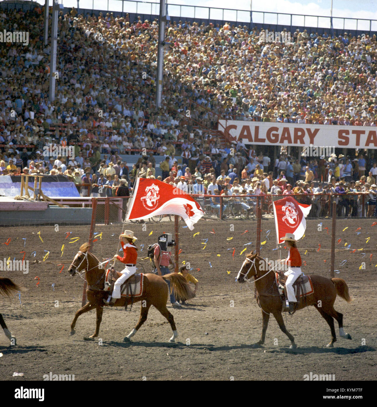 A flag procession at the Calgary Stampede, showcasing participants ...
