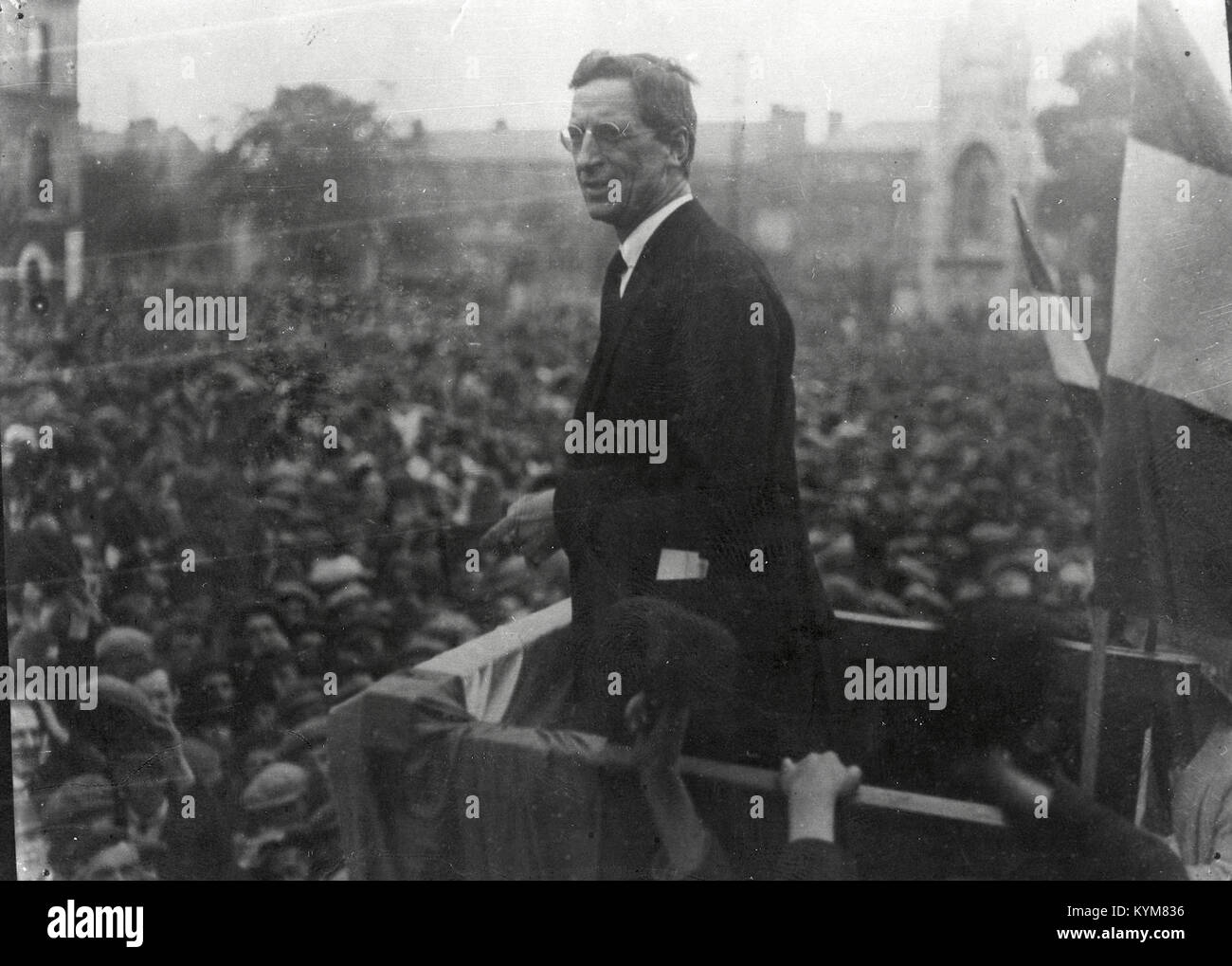 A political rally in Cork, Ireland, showing a large crowd gathered in ...