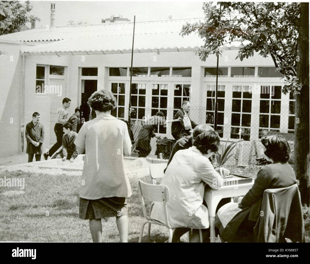A photograph of a sheltered workshop in Paris, France, depicting ...