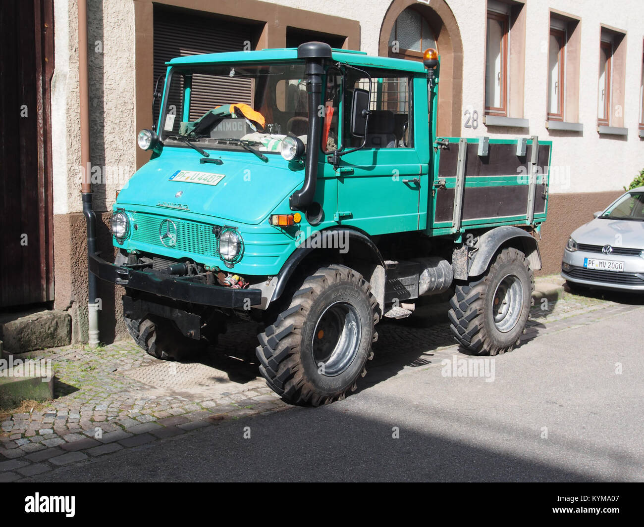 This photograph features a Unimog, a versatile utility vehicle, in ...
