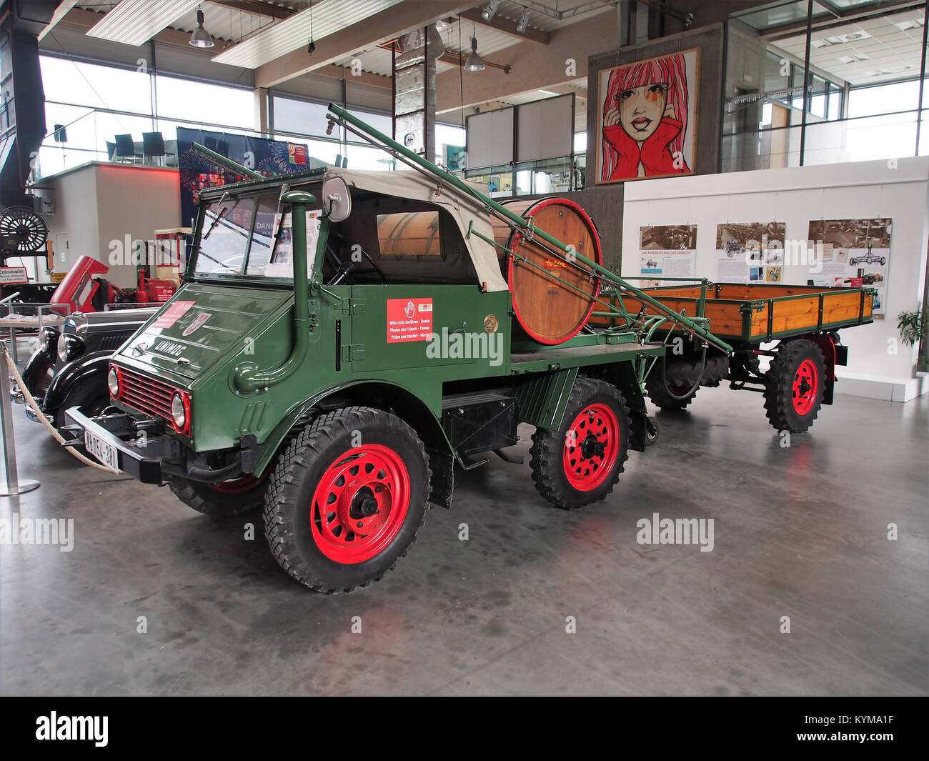 This image features an Unimog with a trailer, displayed at the Unimog ...