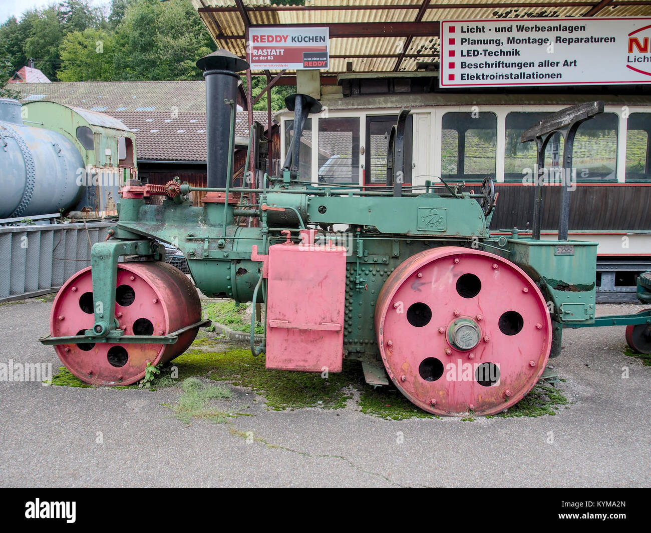 A historical steamroller from Strabag, displayed with a trailer at the ...