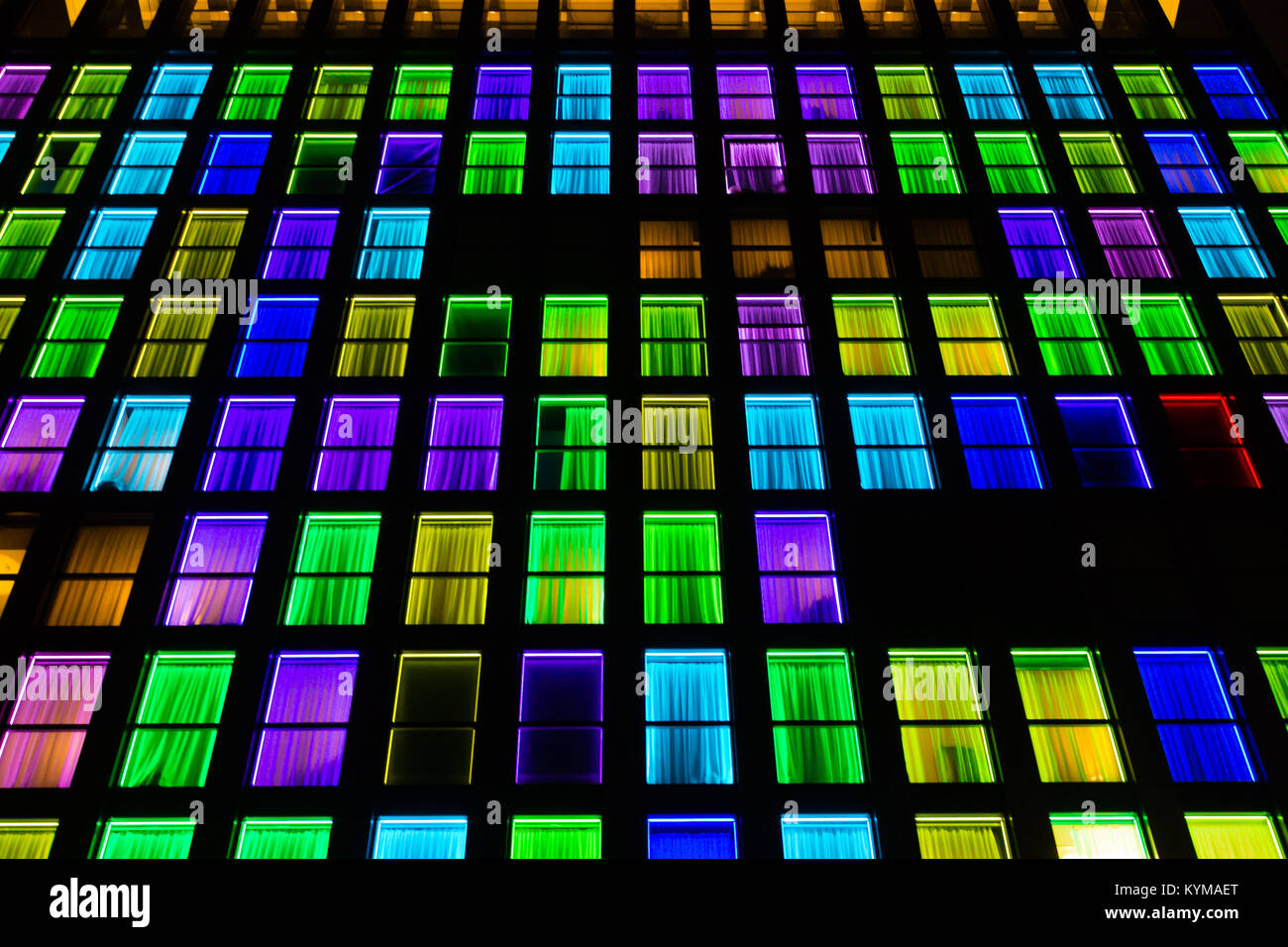 Colored windows texture. Windows illuminated by neon lights background ...