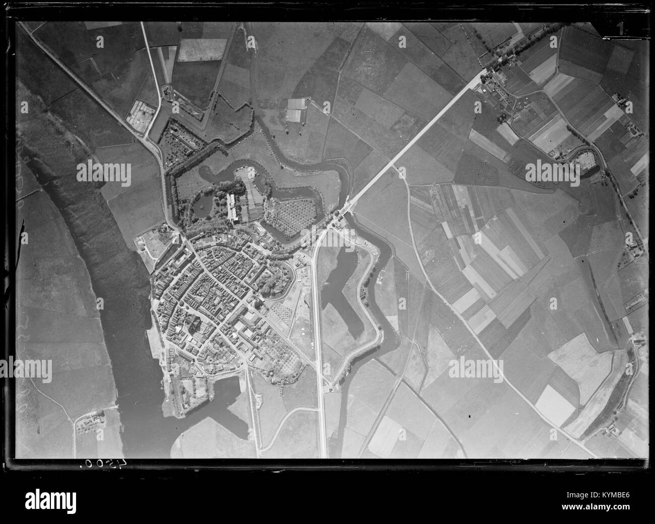 A historical photograph of a grave site, capturing the details of the ...