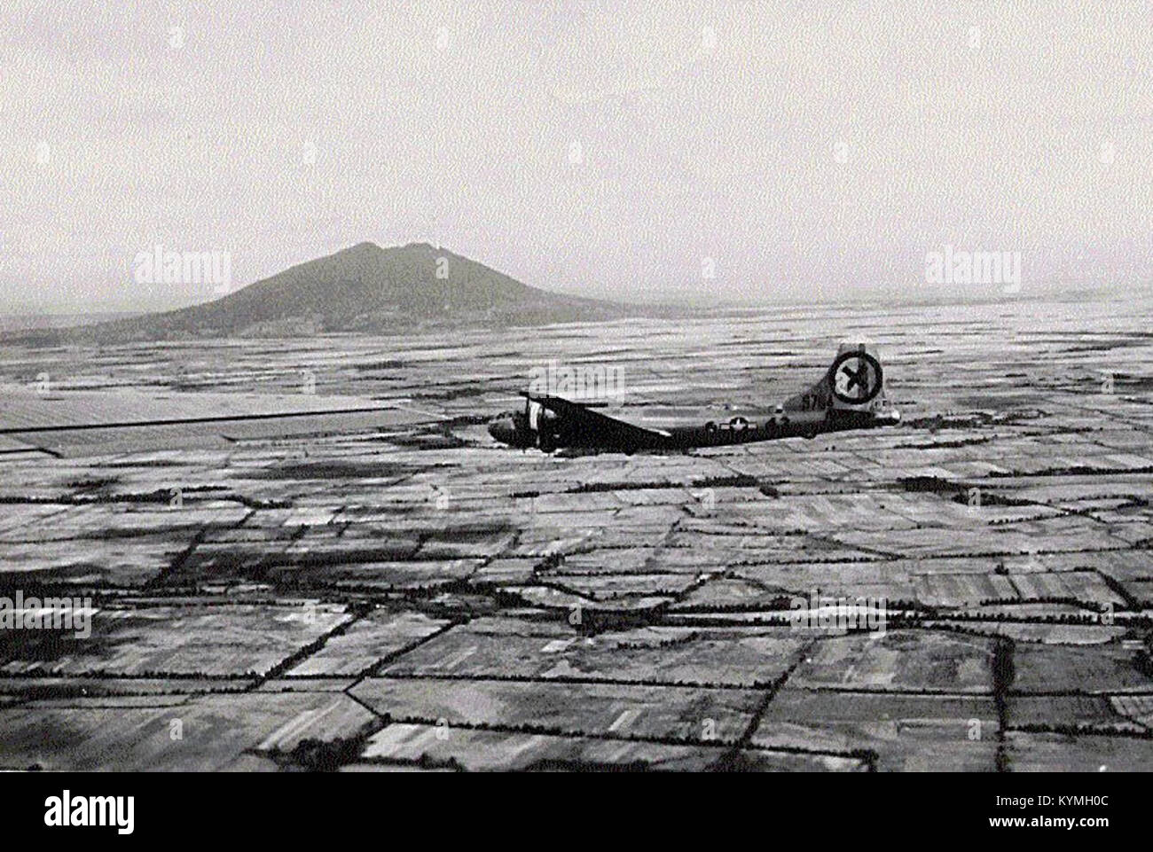 The image shows a historical photograph from the 9th Bomb Group. This ...