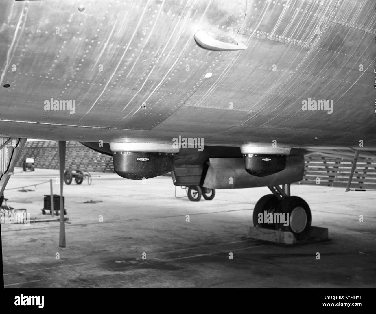 A historical negative photograph showing a Convair aircraft, captured ...