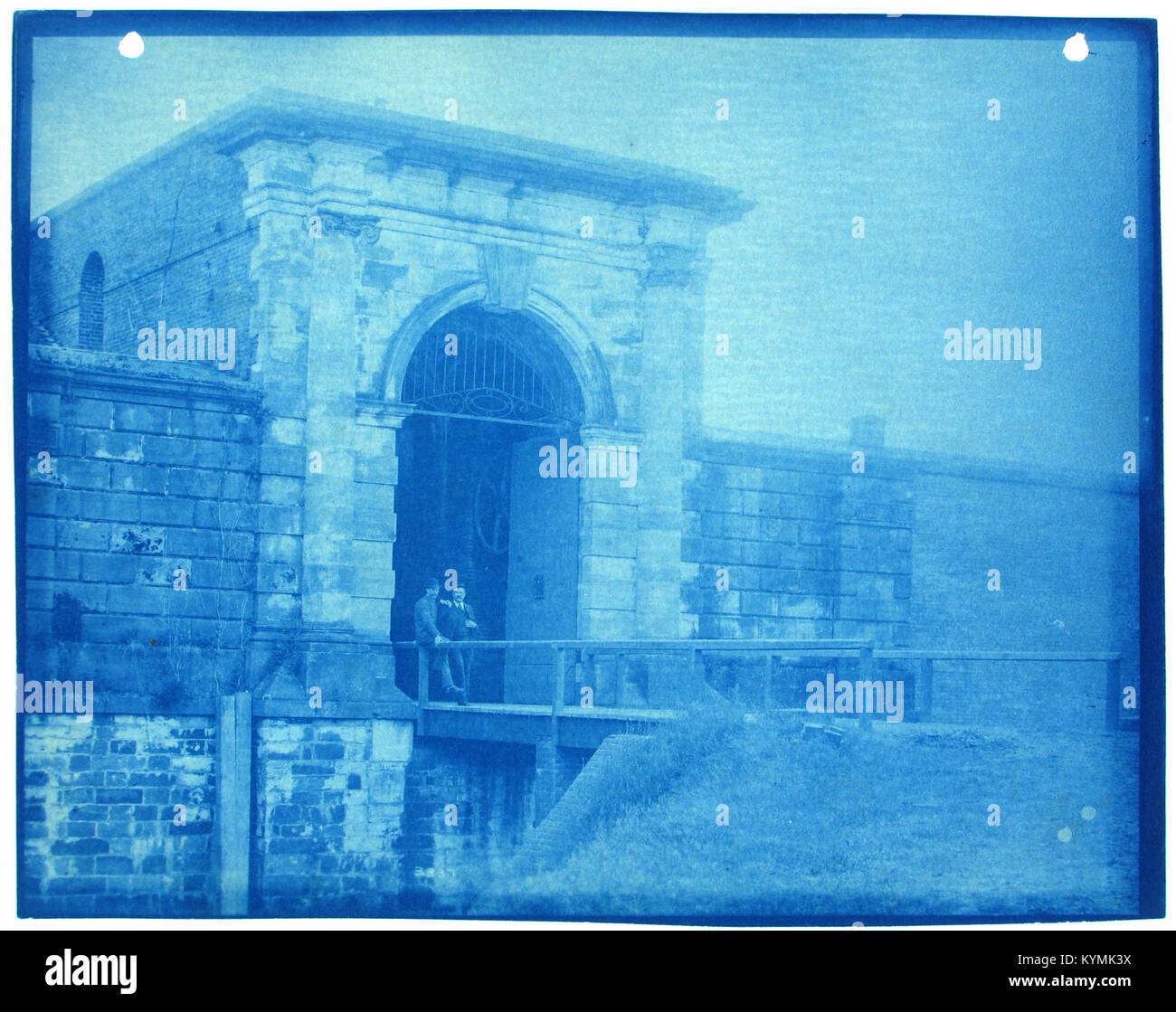 A historic cyanotype illustration depicting a gatehouse, showcasing the ...