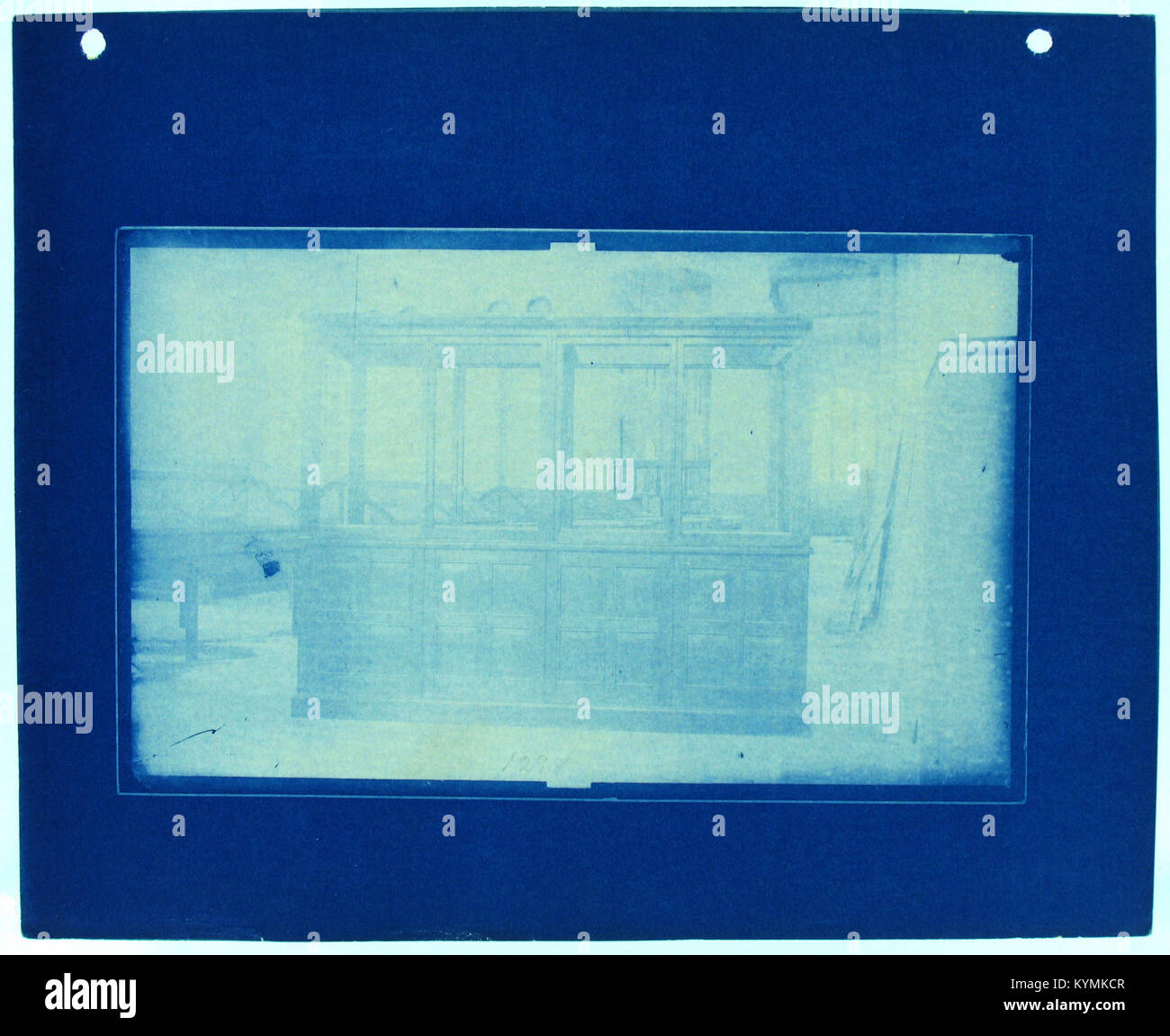 An old photo depicting carpentry tools and a wooden kiosk in a display ...