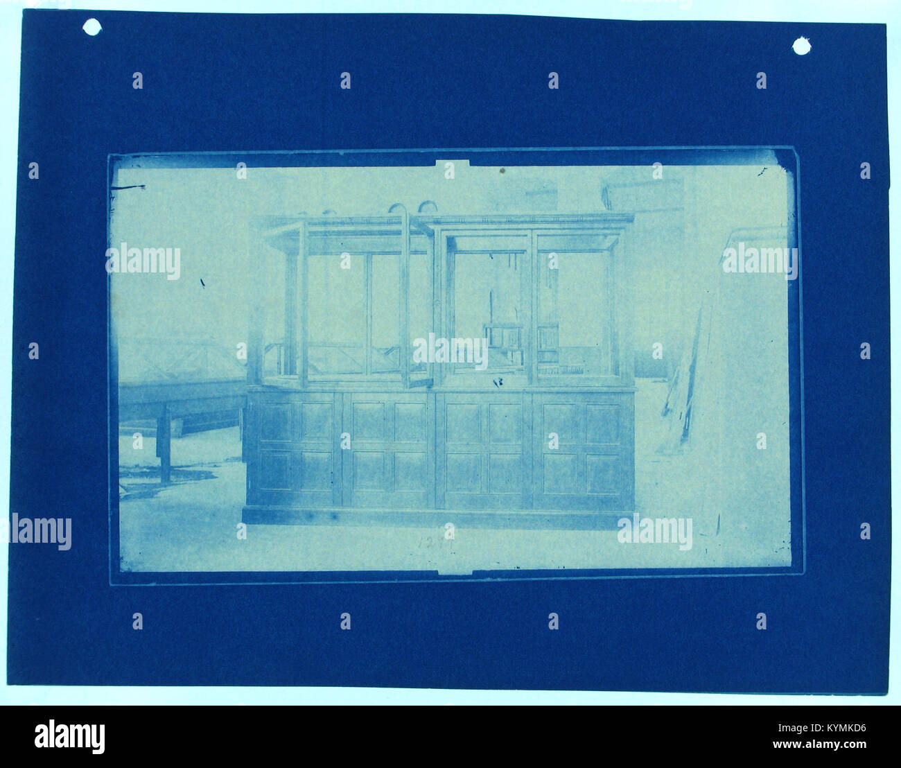 A photograph of an empty glass display case in a Smithsonian Institution museum. The image shows ...