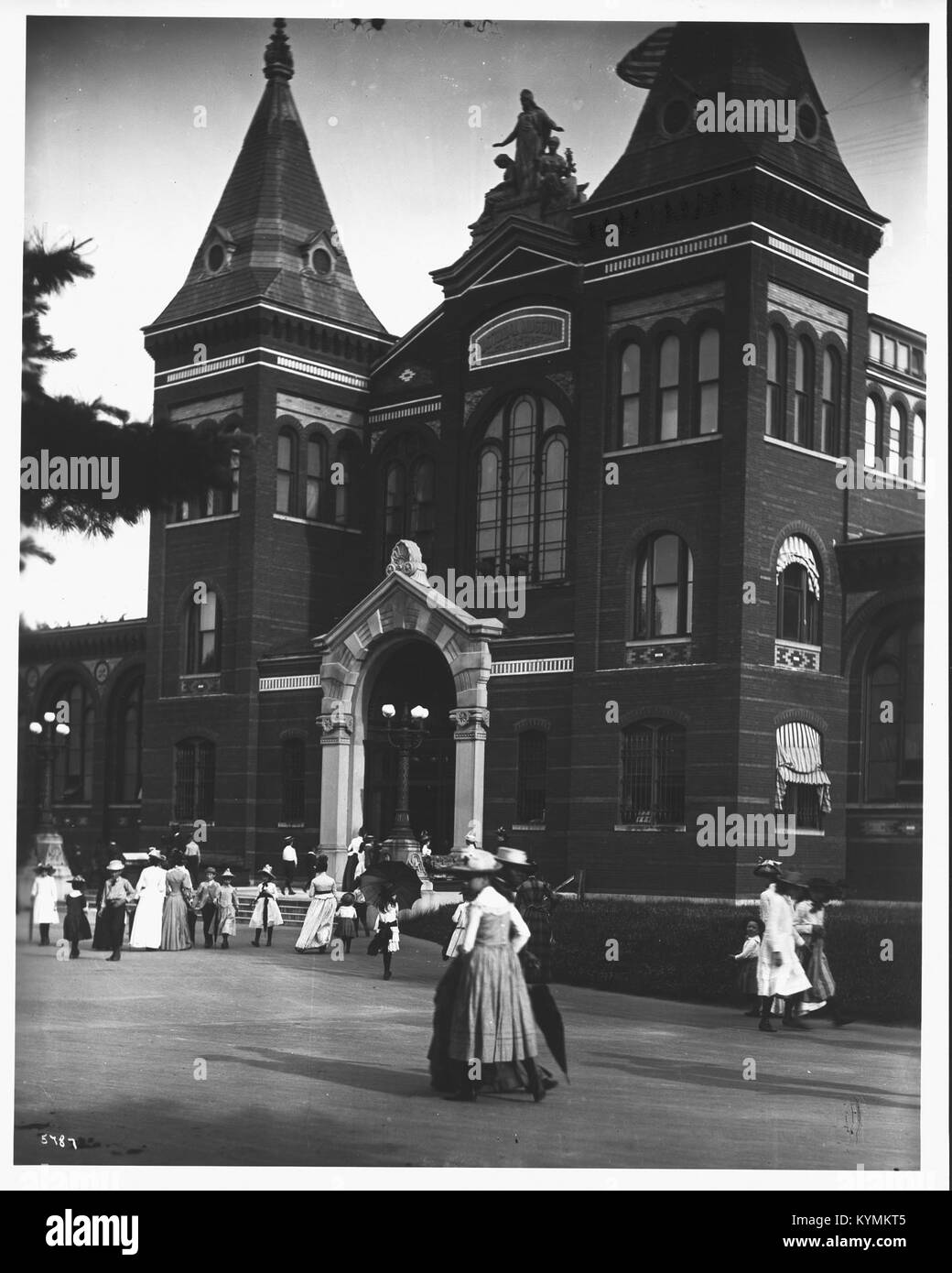 A photograph of visitors standing in front of the U.S. National Museum ...