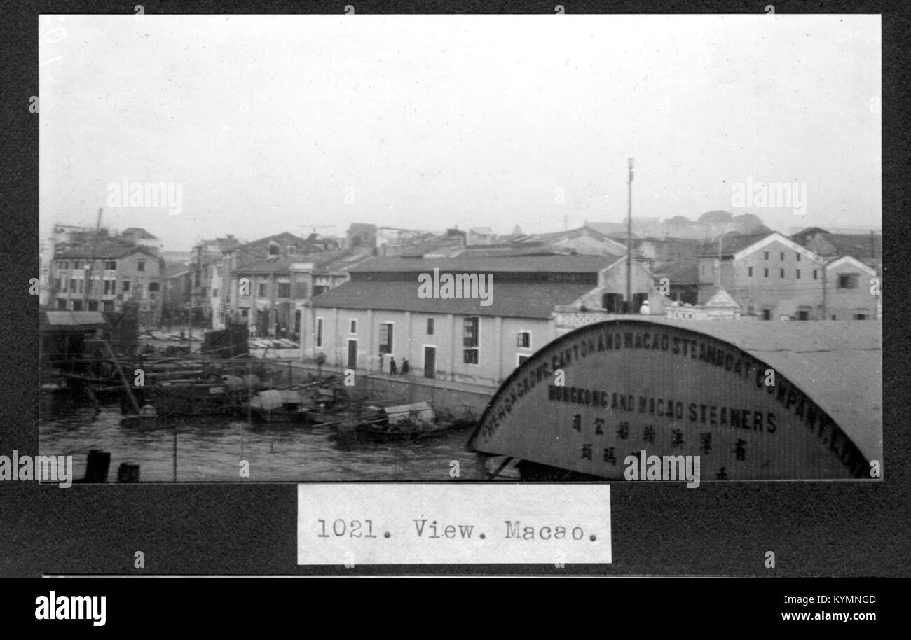 A view of the warehouses and boats in the port of Macao, capturing the ...