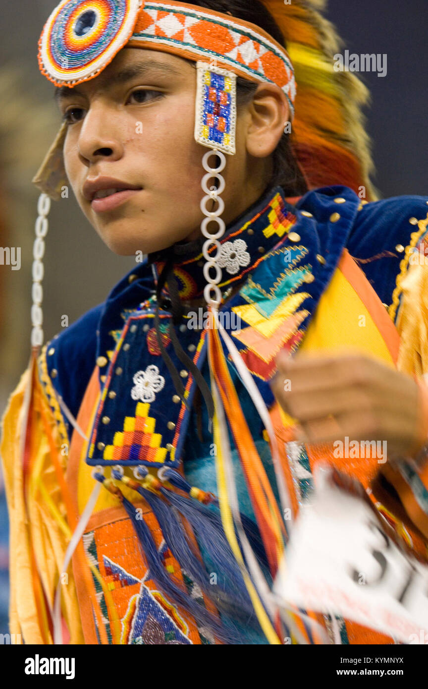 A photograph of an adolescent Native American dancer participating in a ...