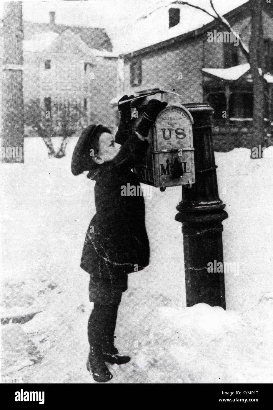 A historical photograph showing people mailing letters. The image ...