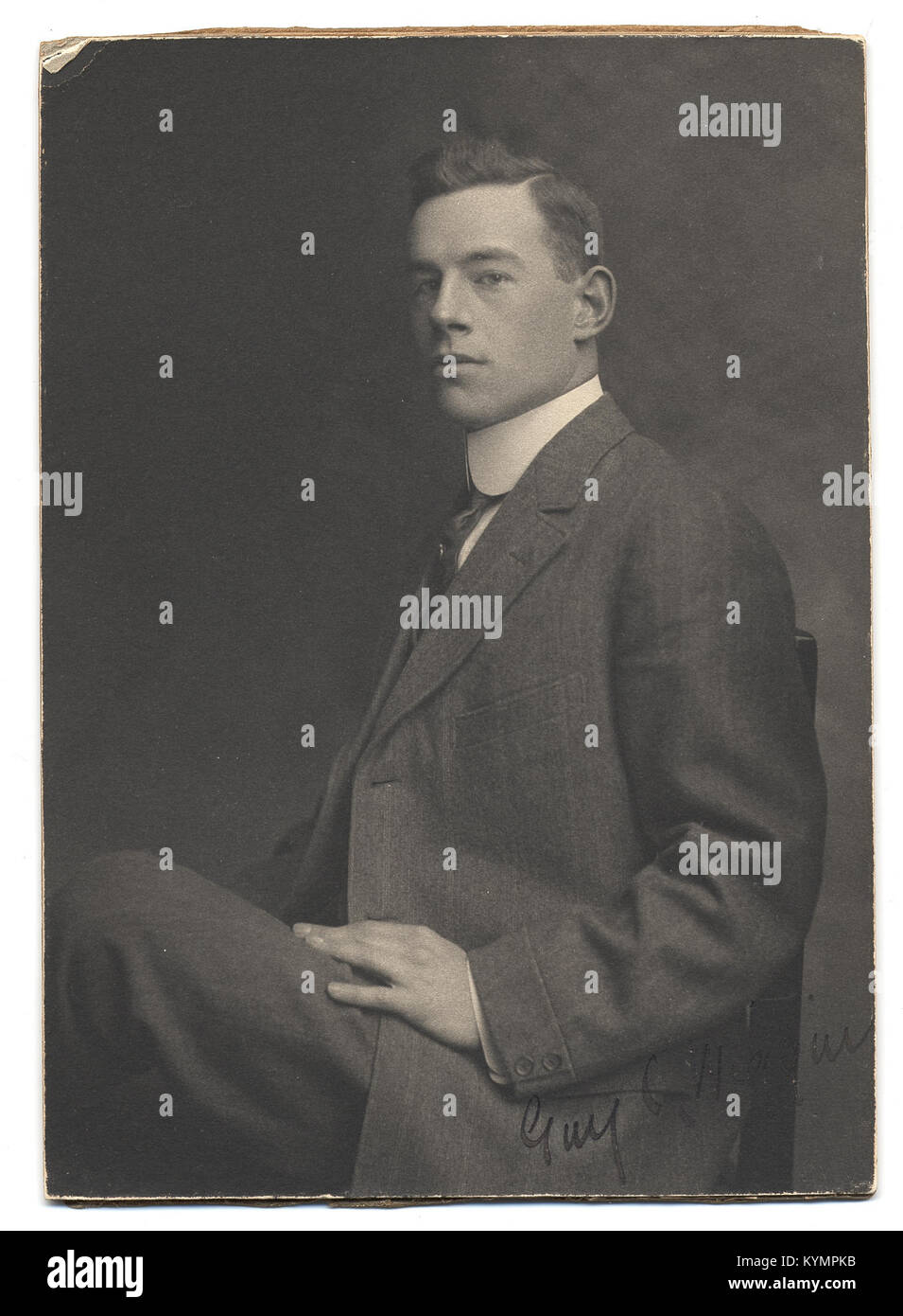 A formal portrait of artist Guy C. Wiggins, captured in black and white ...