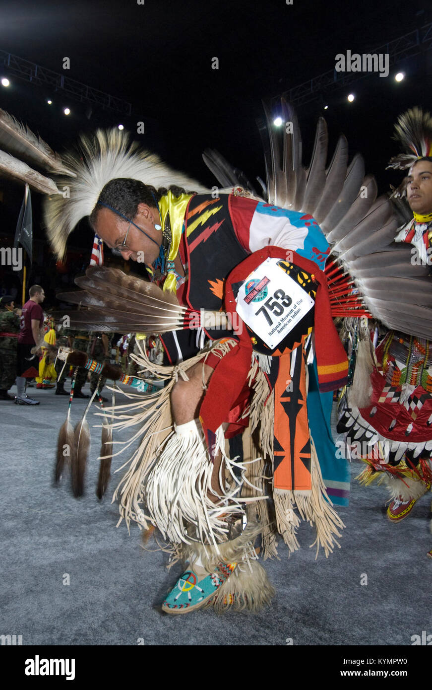 A historic illustration of a Native American male dancer in traditional ...