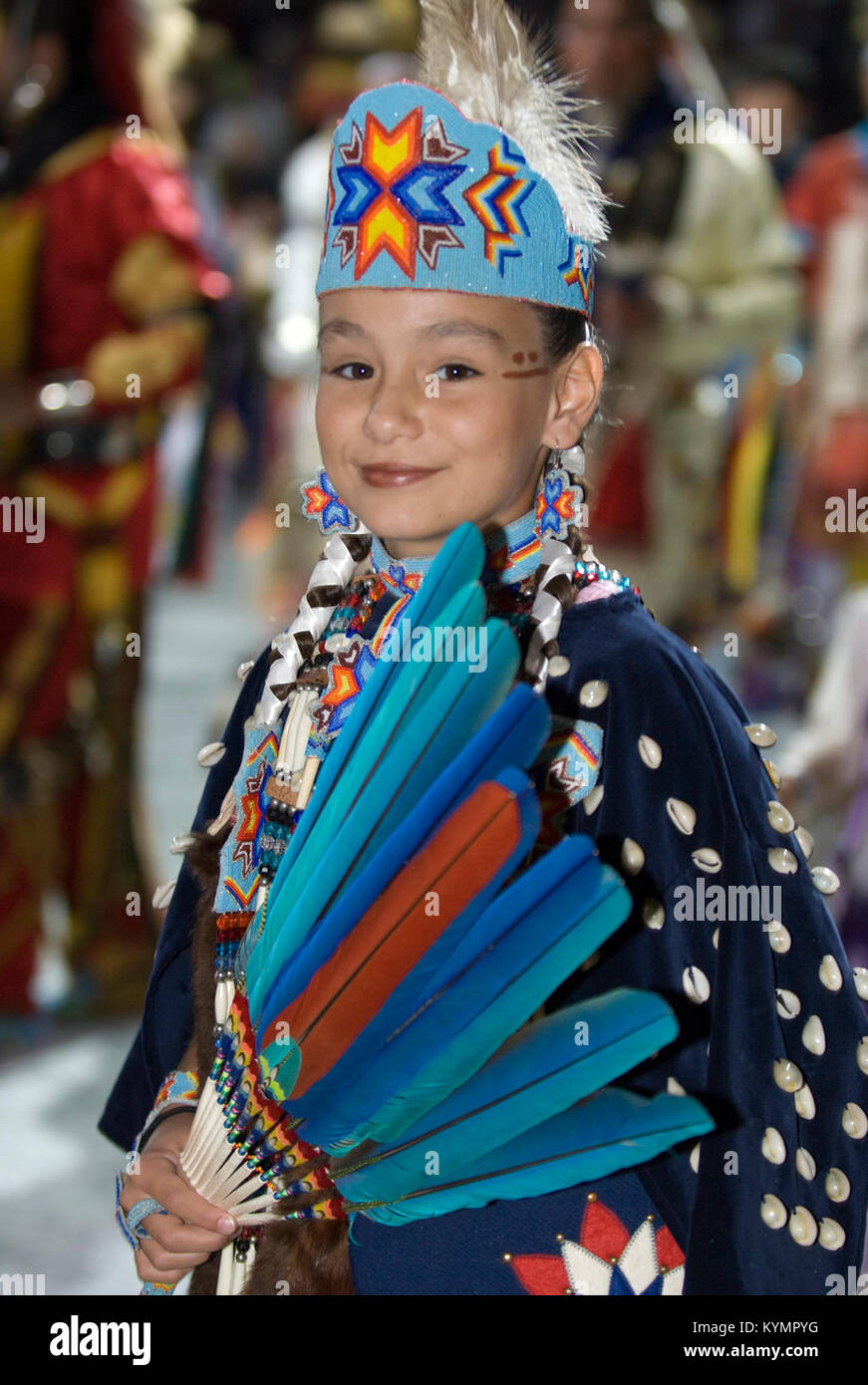 A photograph of a Native American girl participating in a powwow in ...