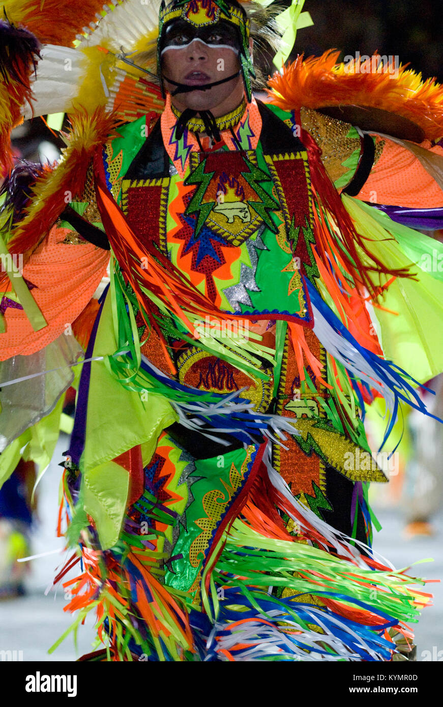 A Native American dancer dressed in traditional ceremonial attire ...