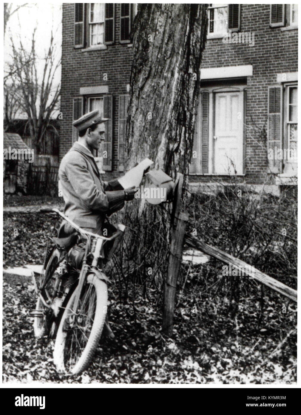 A black and white photograph from the 1800s showing a letter carrier ...