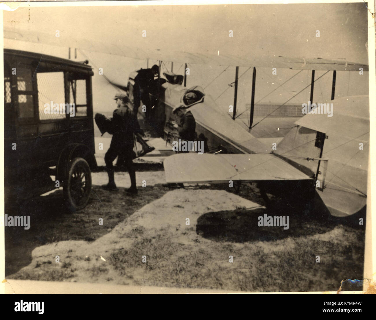 A historic photograph showing the unloading of airmail at the ...