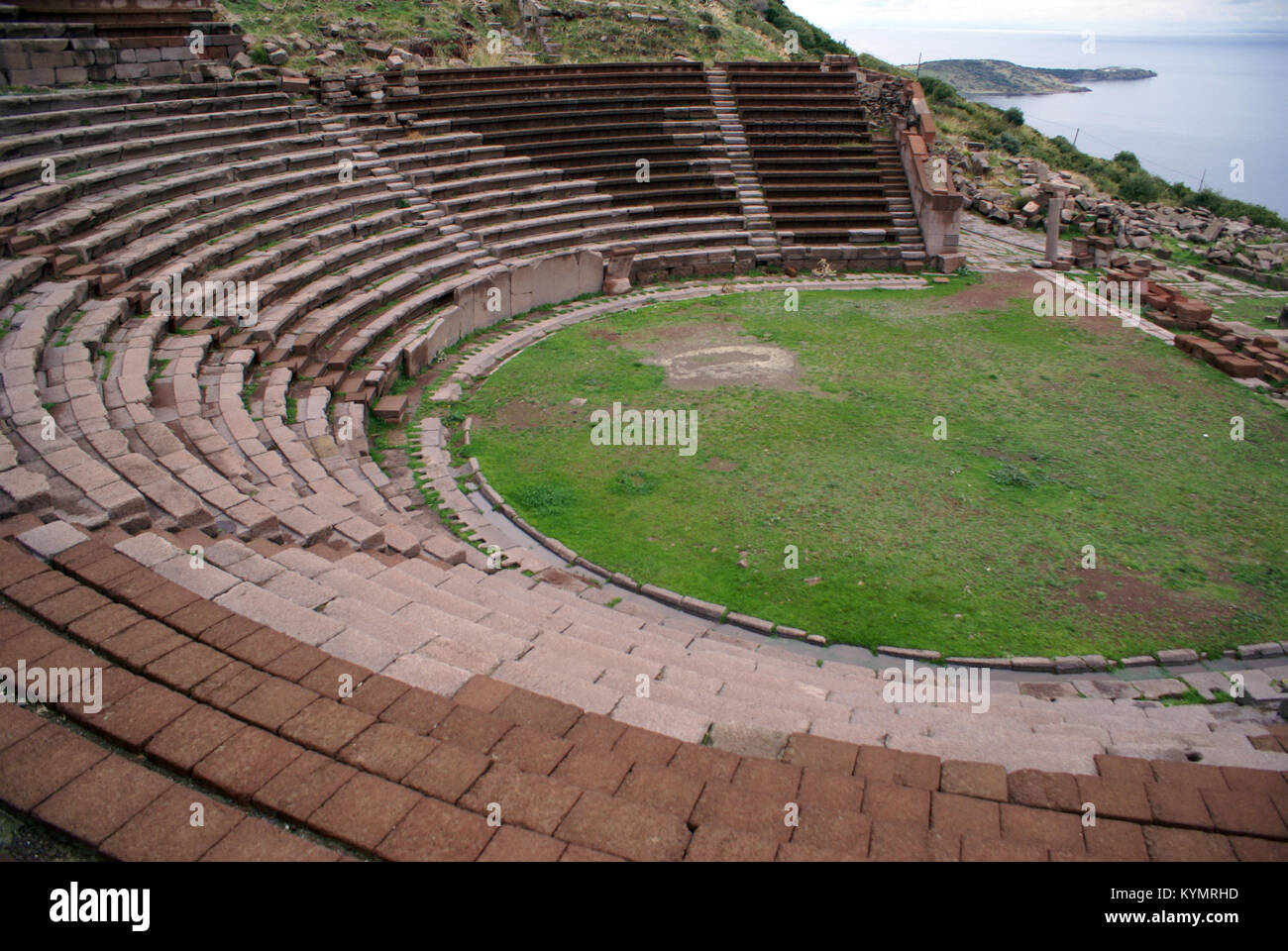 Theater on the slope of hill in Assos, Behramkale Stock Photo - Alamy