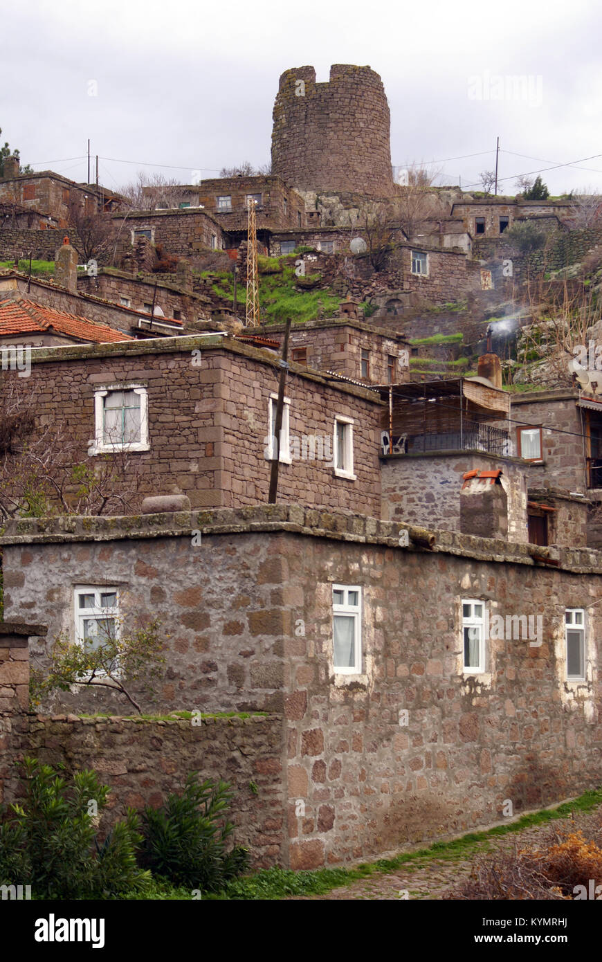 Old tower and turkish village in Behramkale, Turkey Stock Photo - Alamy