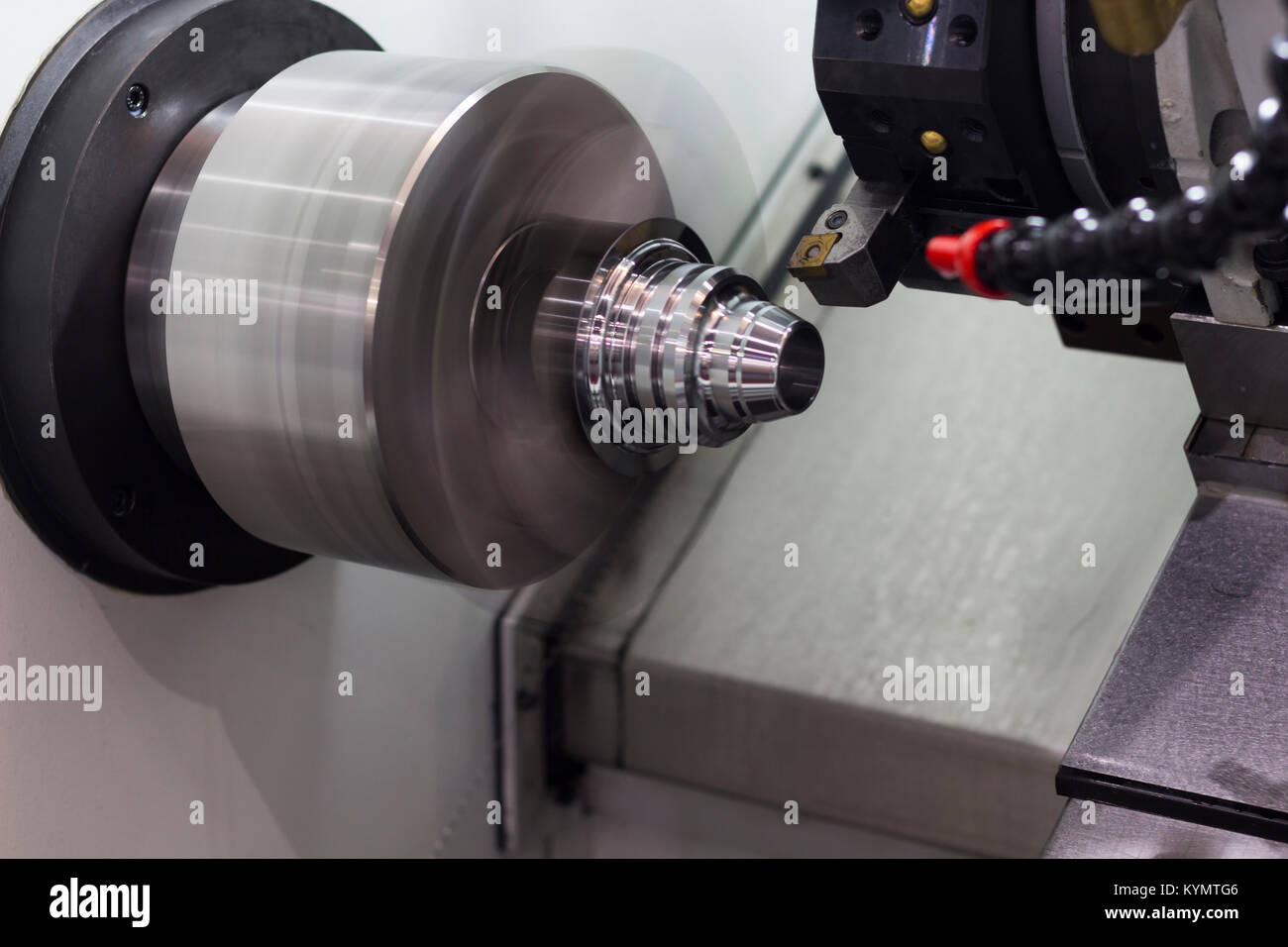 workpiece rotating in a CNC lathe machine : Side view Stock Photo - Alamy