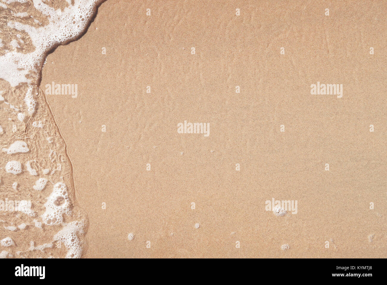 Transparent soft wave on sandy beach Stock Photo - Alamy