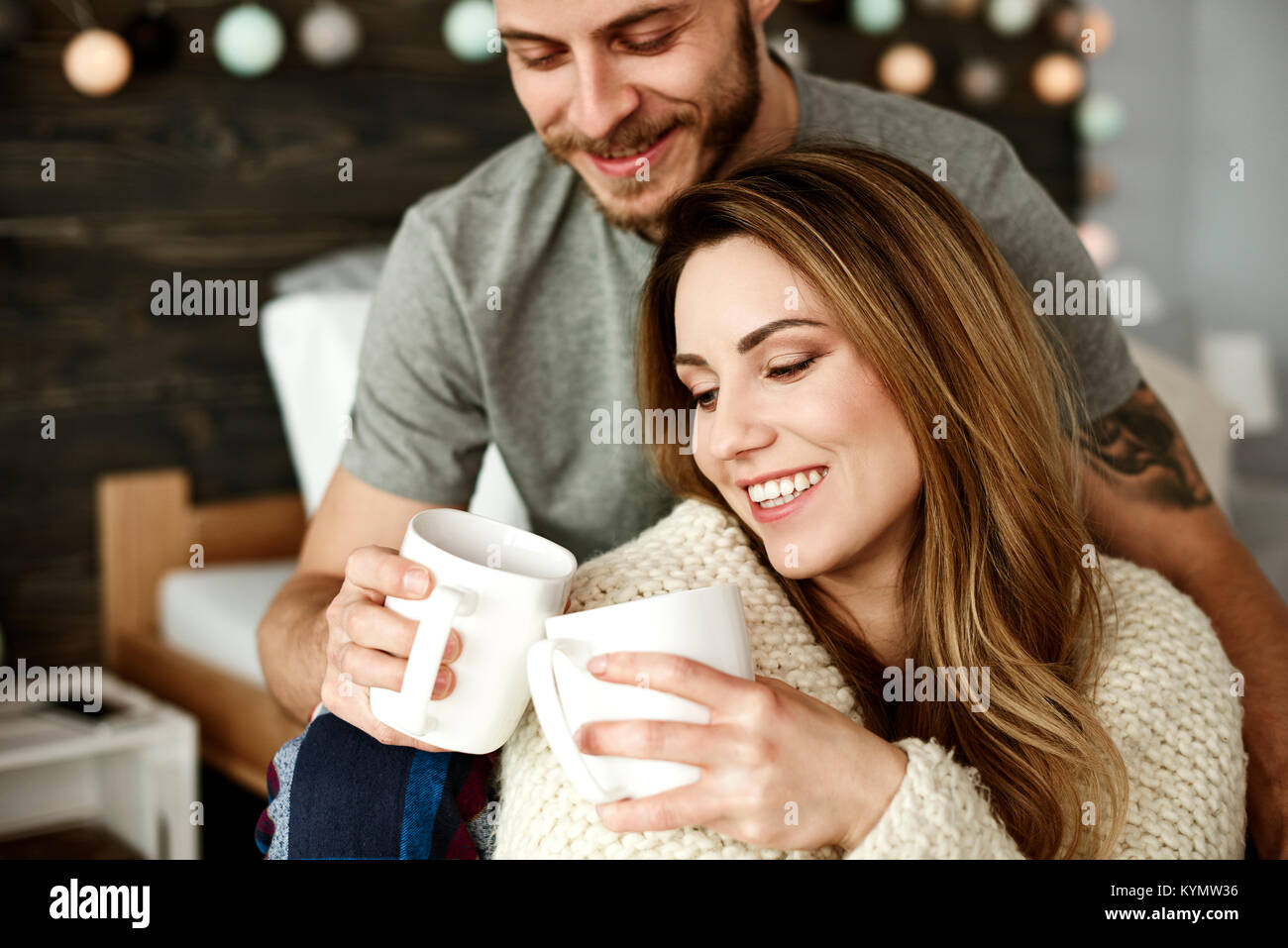 In love couple drinking coffee in bedroom Stock Photo - Alamy
