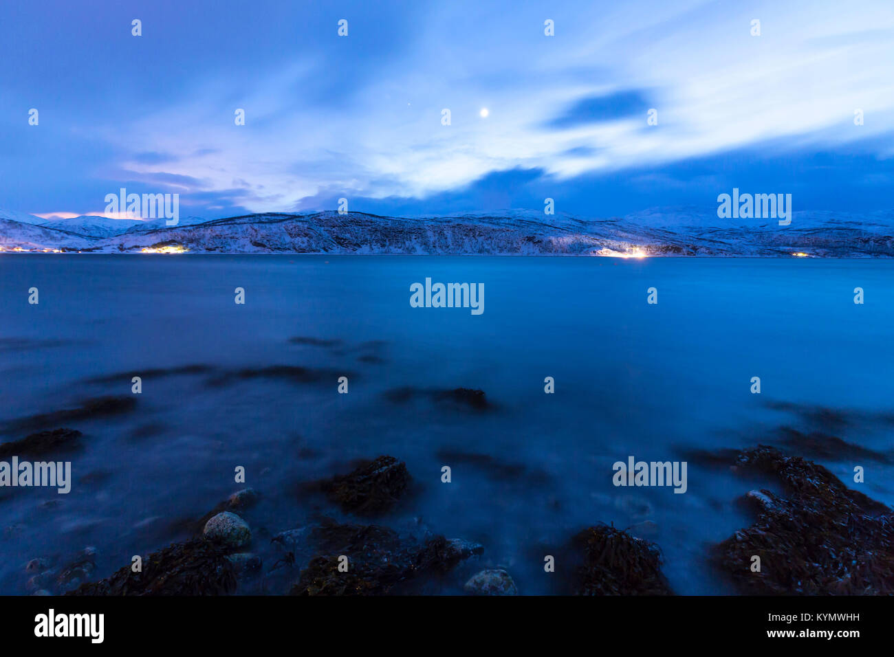 Typical norwegian coastline with rocks at low tide at a fjord in Troms ...