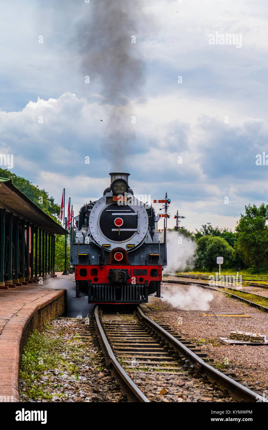 locomotive enters the platform, an old steam train Stock Photo - Alamy