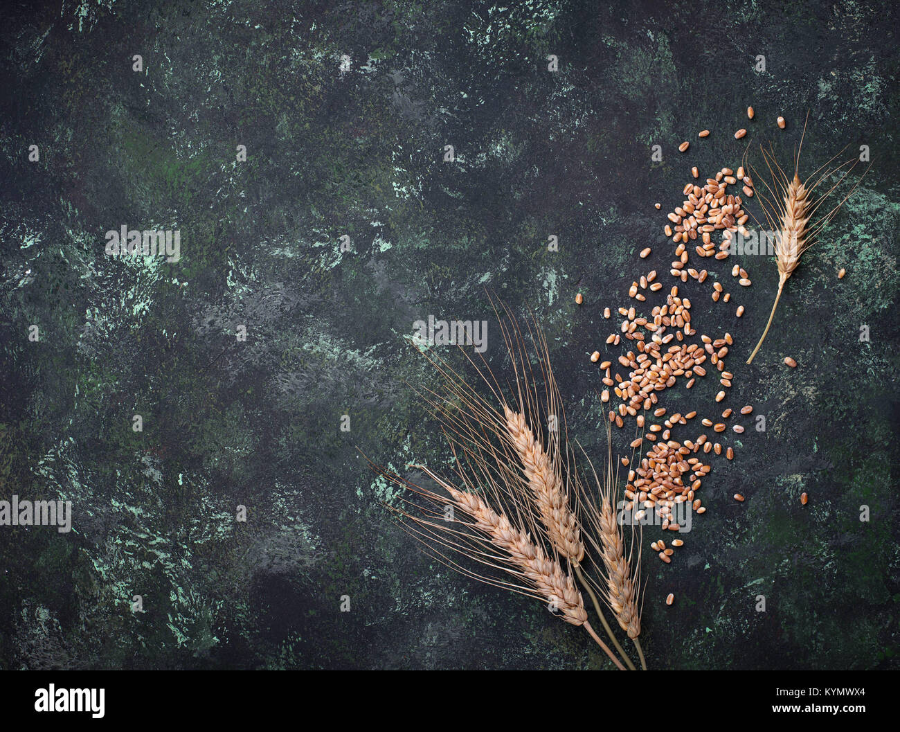 Wheat grains and spikelets on rusty background Stock Photo - Alamy