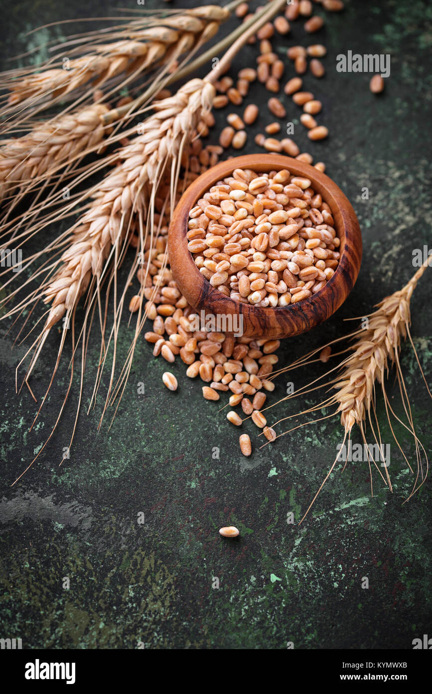 Wheat grains and spikelets on rusty background Stock Photo - Alamy