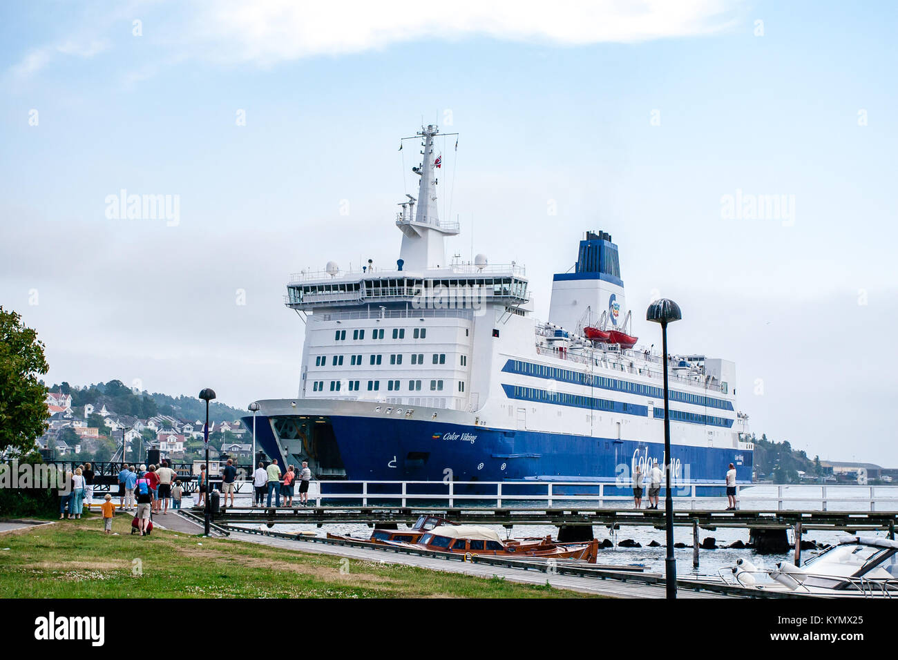 People watching Norwegian Cruise Ferry Color Viking boarding cars and ...