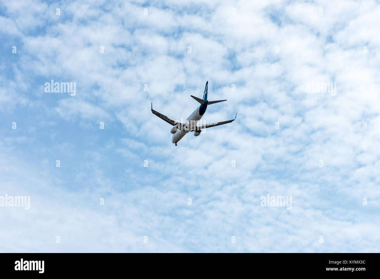 Commercial airplane flying above the sky Stock Photo - Alamy