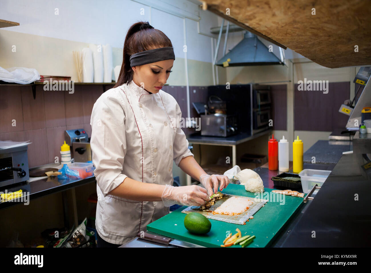 female chef preparing a sushi restaurant in the kitchen Stock Photo - Alamy