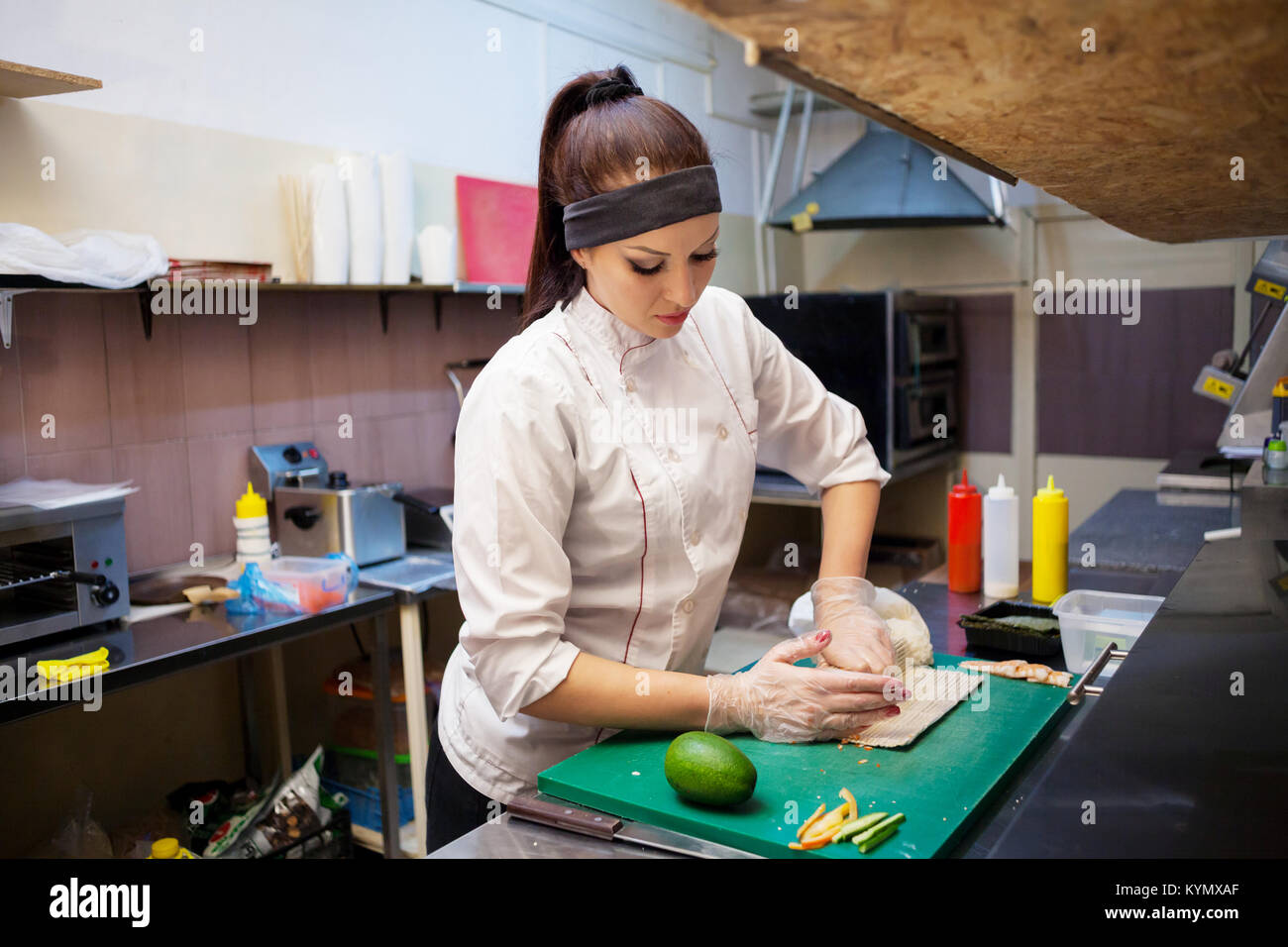 female chef preparing a sushi restaurant in the kitchen Stock Photo - Alamy