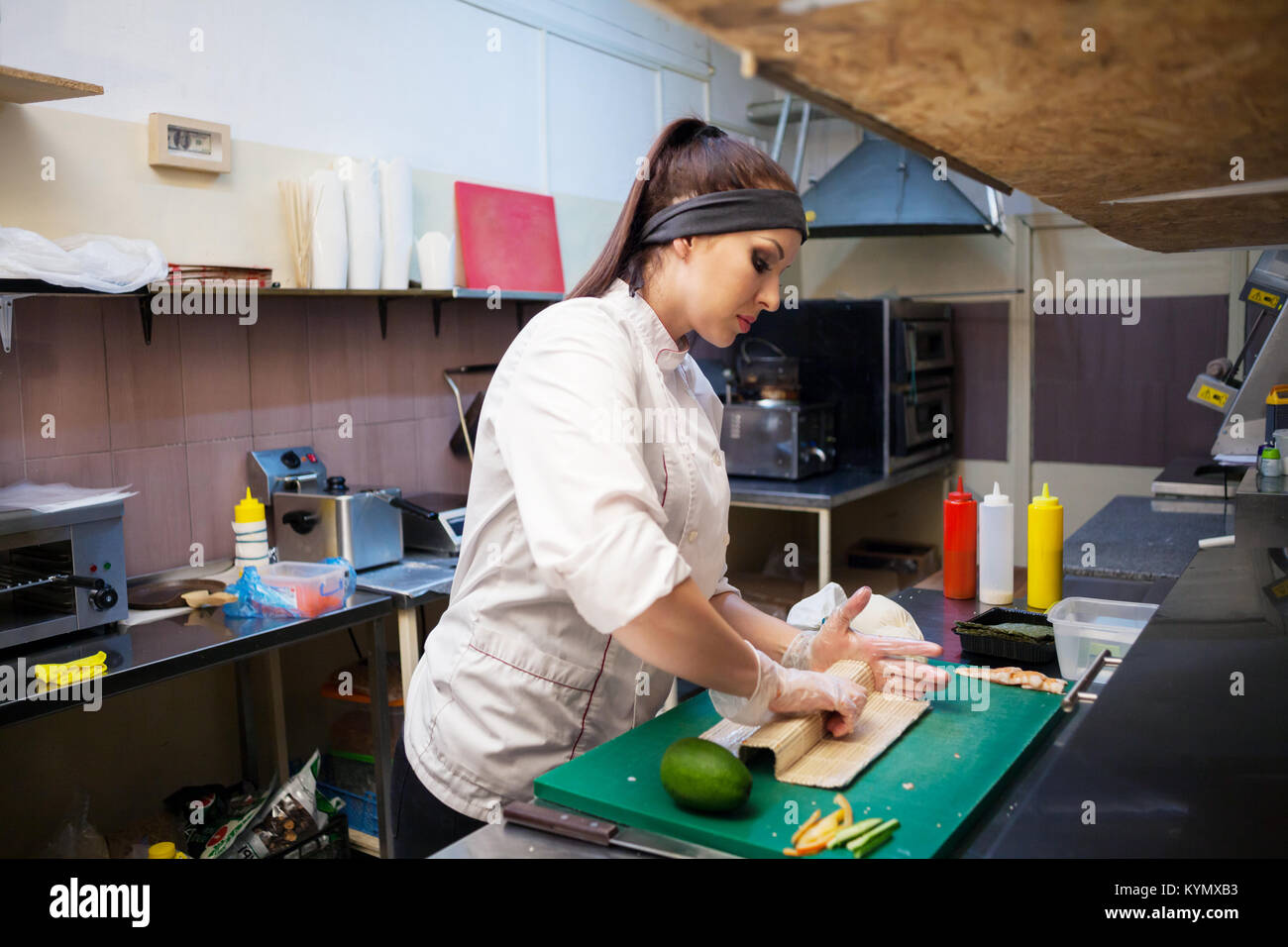 female chef preparing a sushi restaurant in the kitchen Stock Photo - Alamy