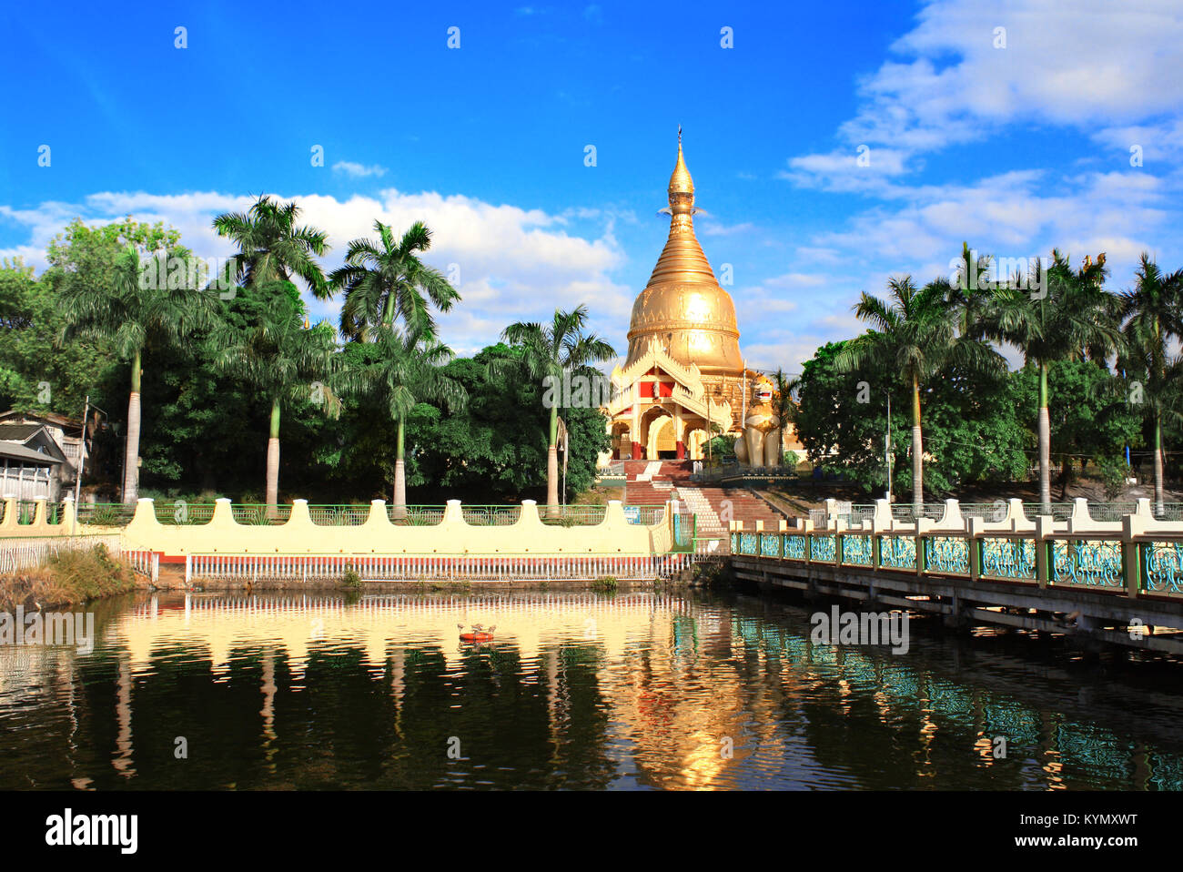 Biggest monastery and golden stupa, Myanmar(Burma). On blue sky ...