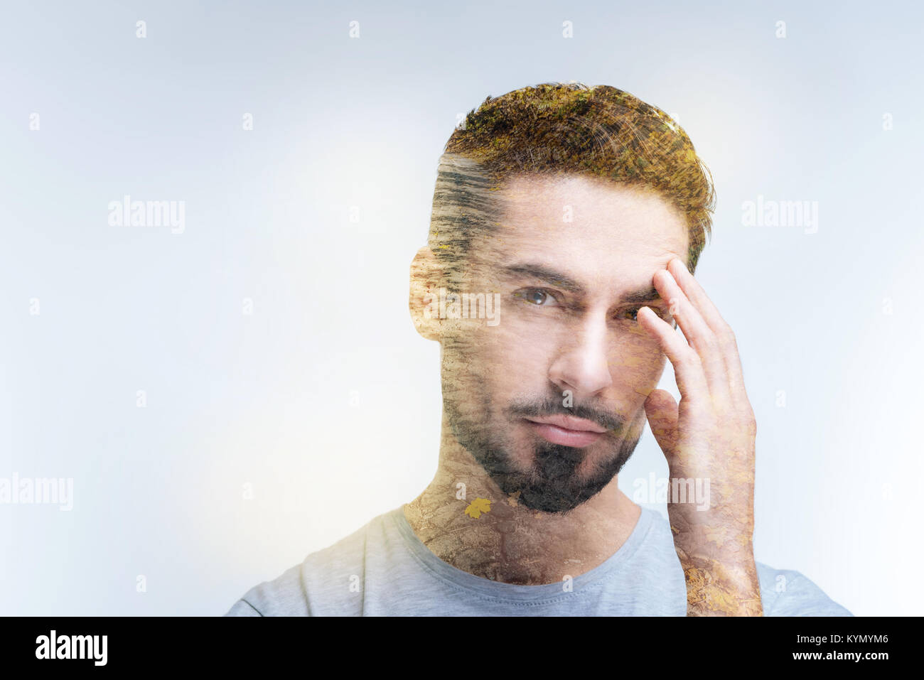 Determined bearded man considering options Stock Photo - Alamy