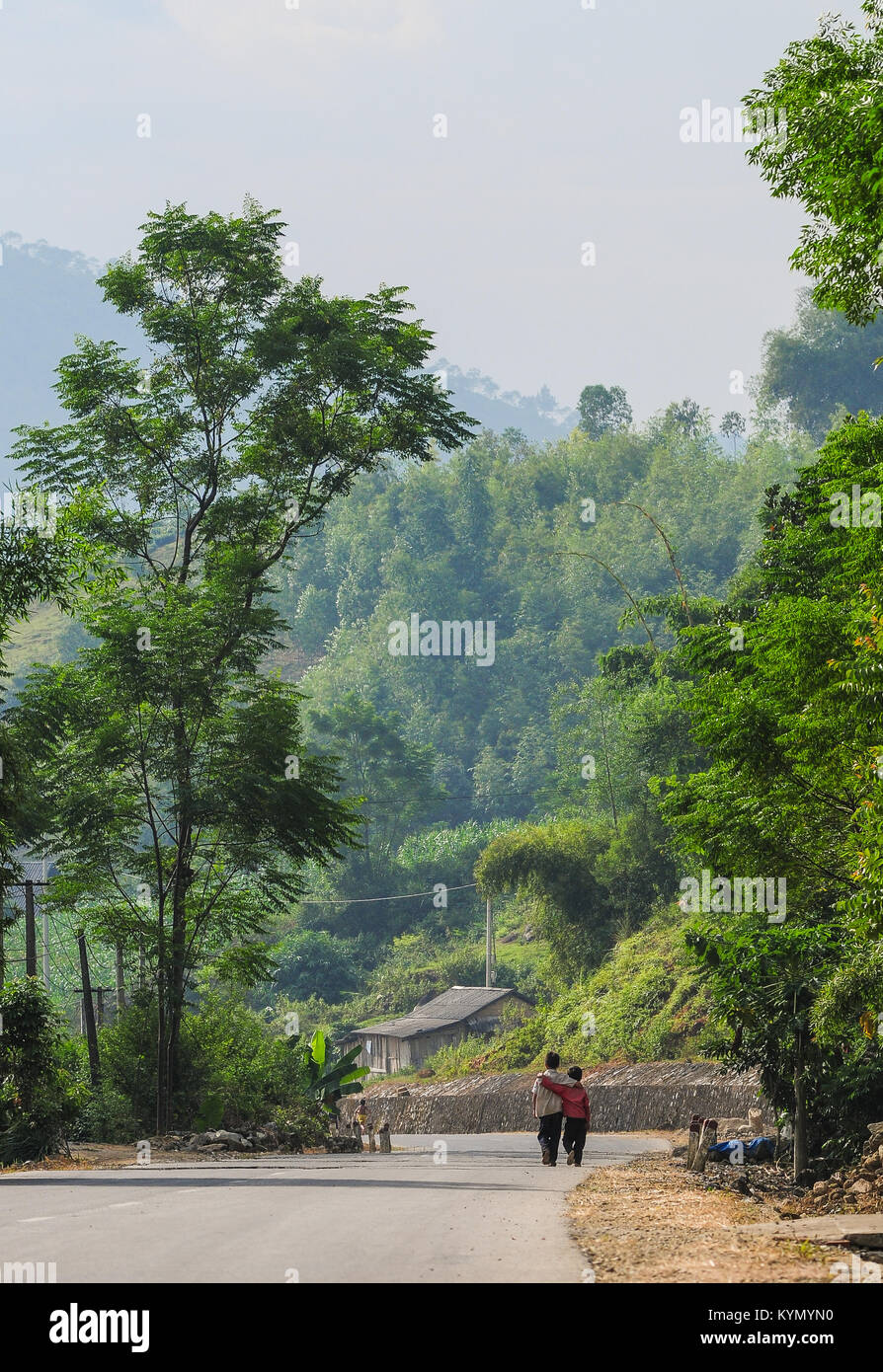 Children walking on rural road at summer day in Northern Vietnam Stock ...
