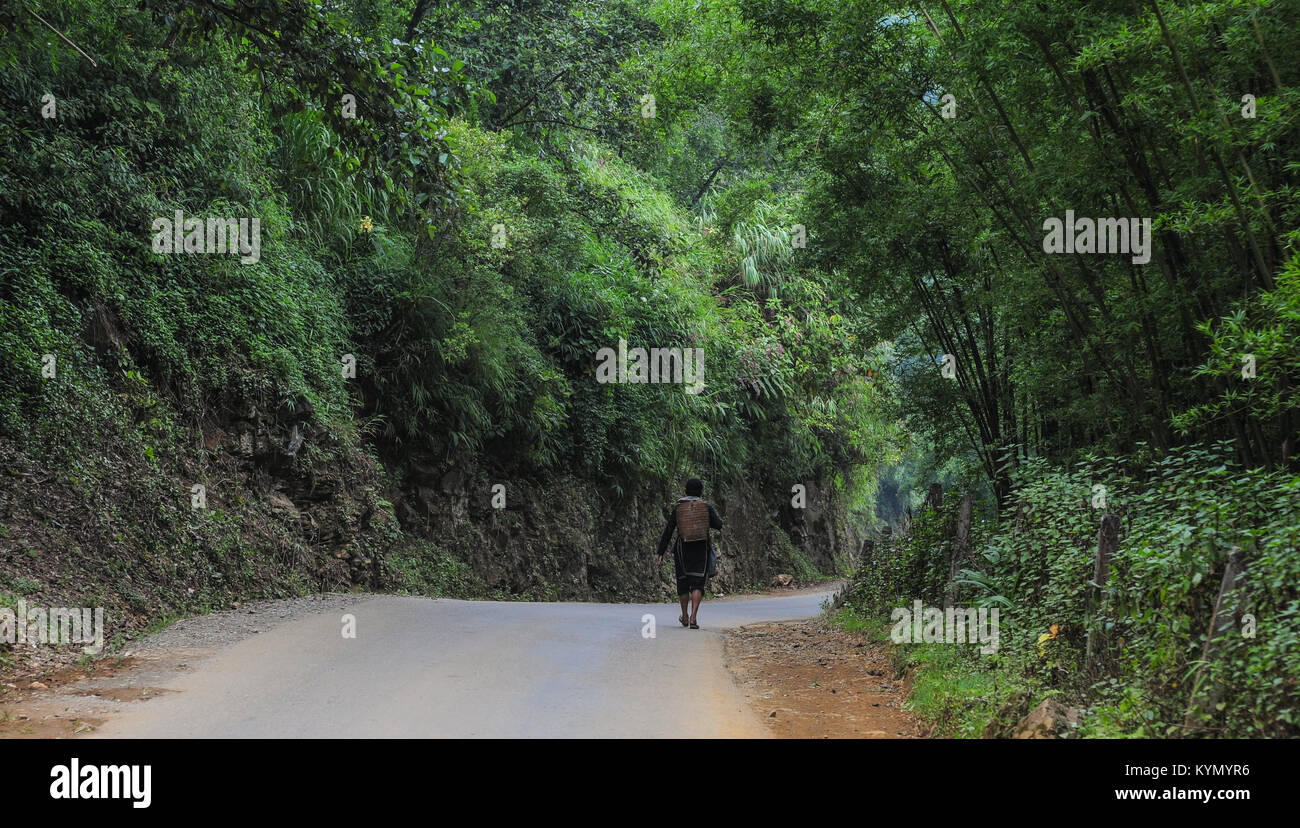 A Hmong man walking on rural road in Northern Vietnam Stock Photo - Alamy