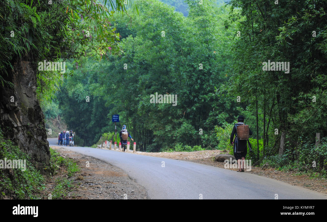 Hmong people walking on rural road in Northern Vietnam Stock Photo - Alamy