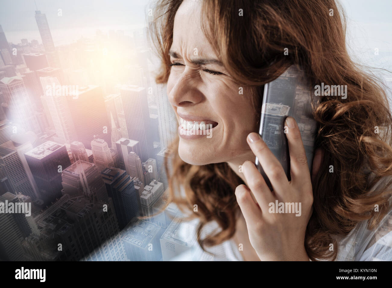 Portrait of sad female that holding her gadget Stock Photo - Alamy