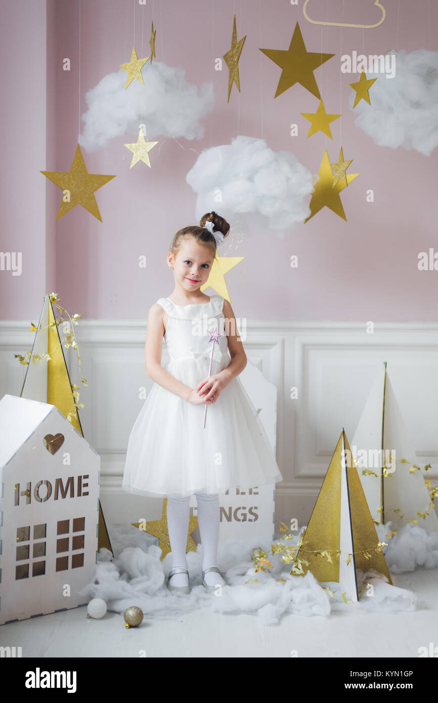 Little happy fairy or angel with magic wand on Holiday theme. Portrait ...