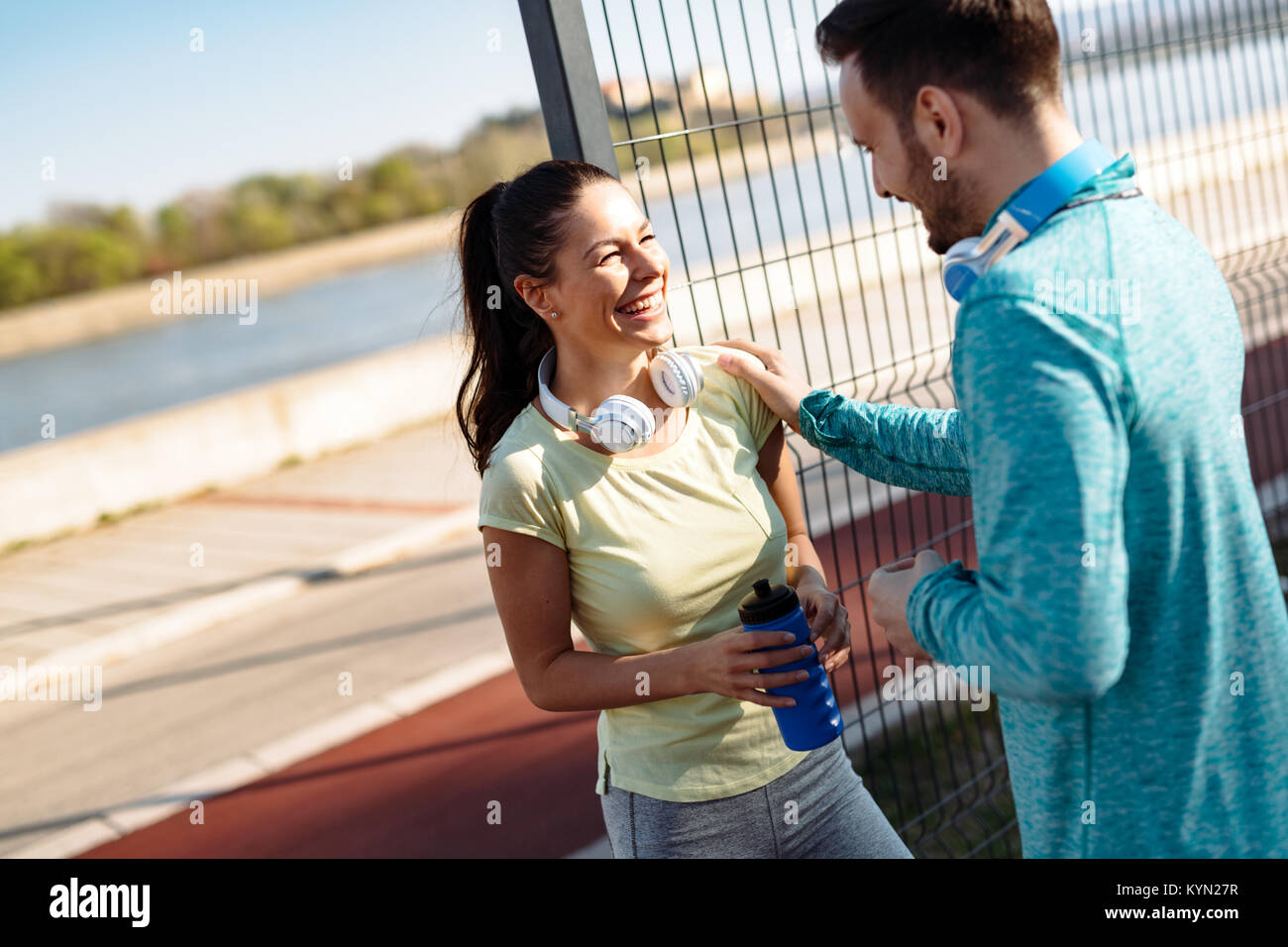 Handsome man and attractive woman talking on court Stock Photo - Alamy
