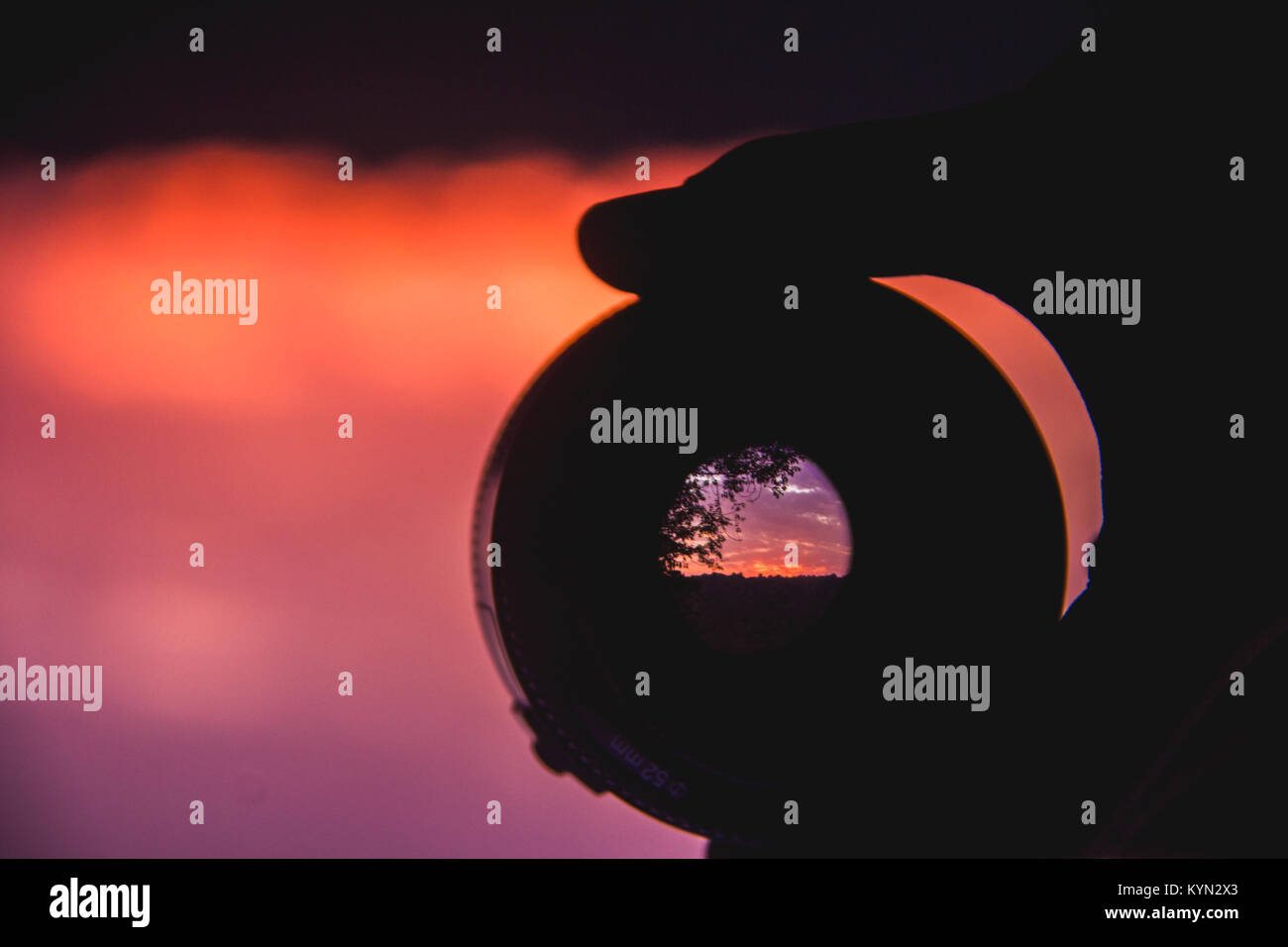 An inverted sunset through a lens Stock Photo - Alamy