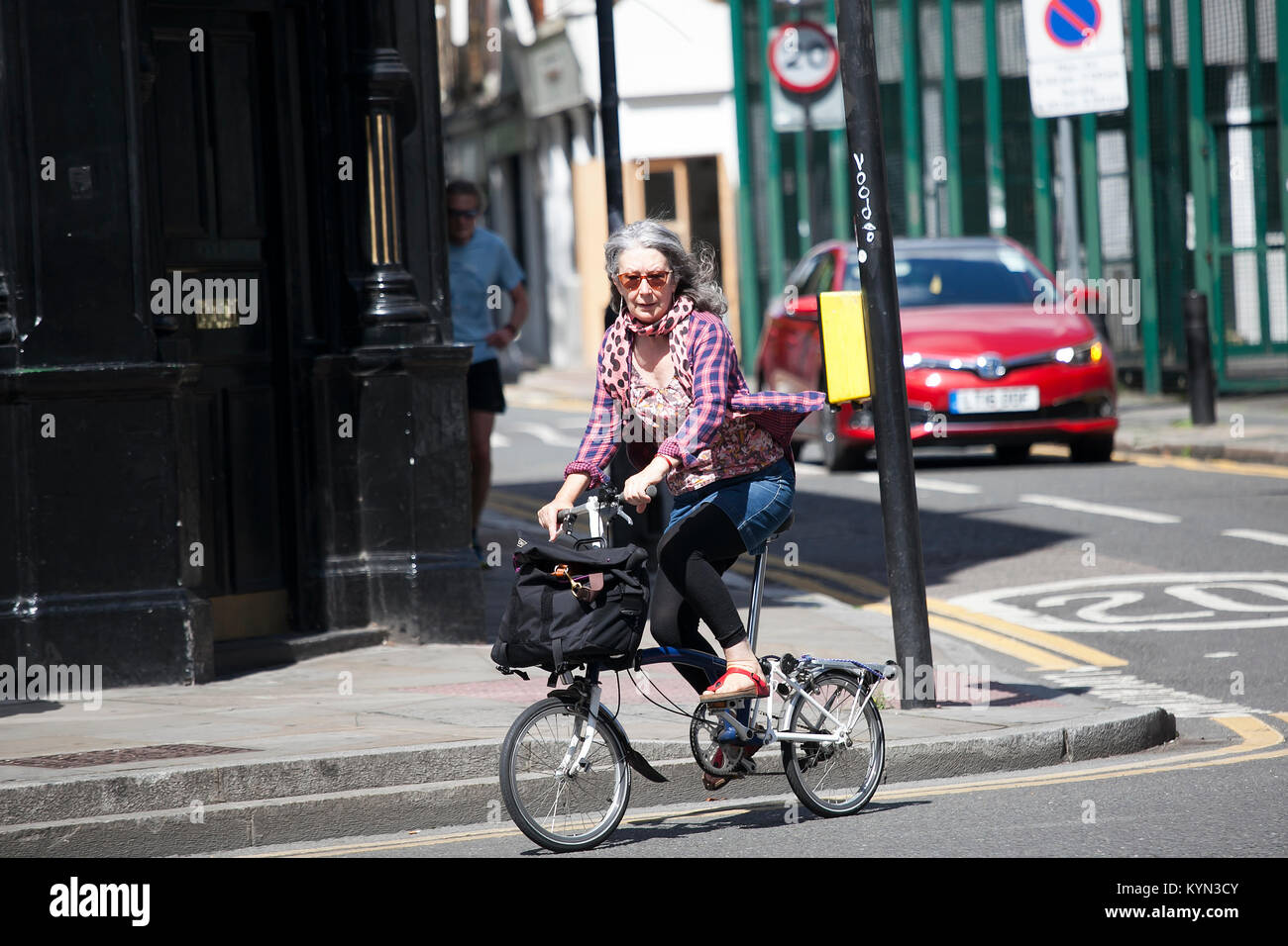 Attractive mature woman riding bike hi-res stock photography and images - Alamy