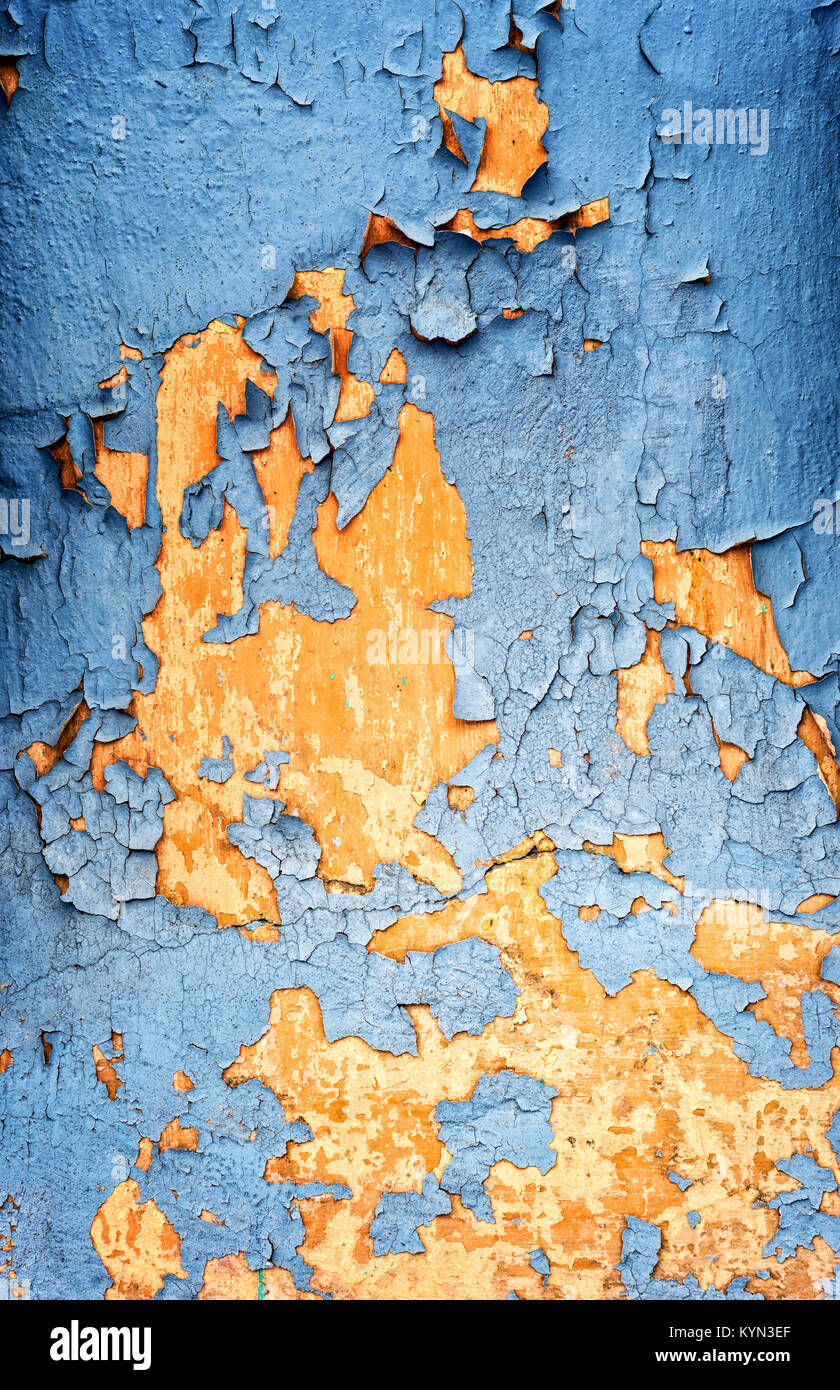 Crumbling flaking retro blue paintwork on an old and aging plaster wall ...