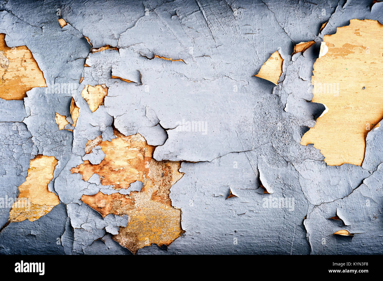 Crumbling flaking retro blue paintwork on an old and aging plaster wall ...