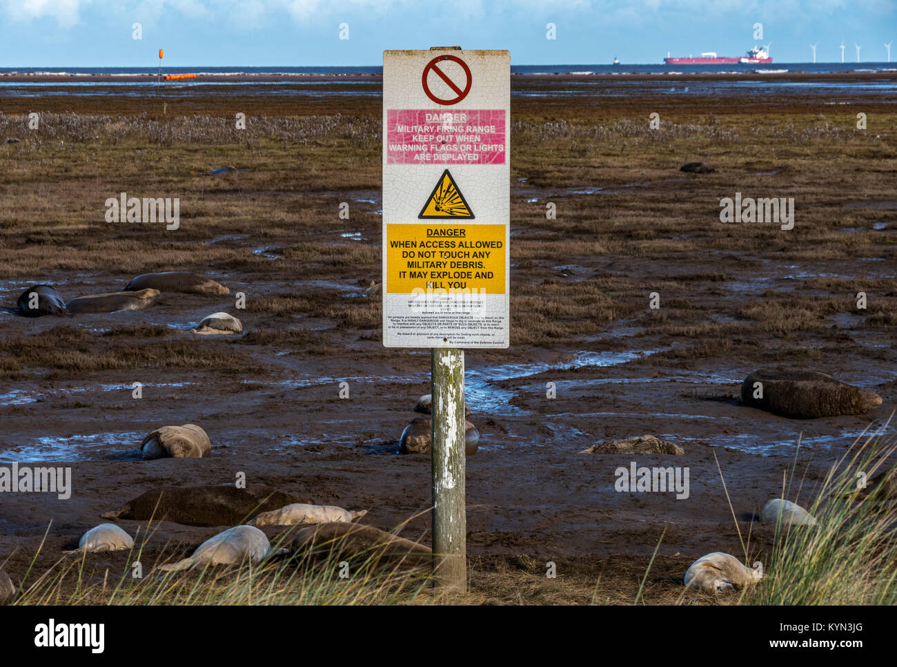 Danger warning sign on beach at Donna Nook National Nature Reserve ...